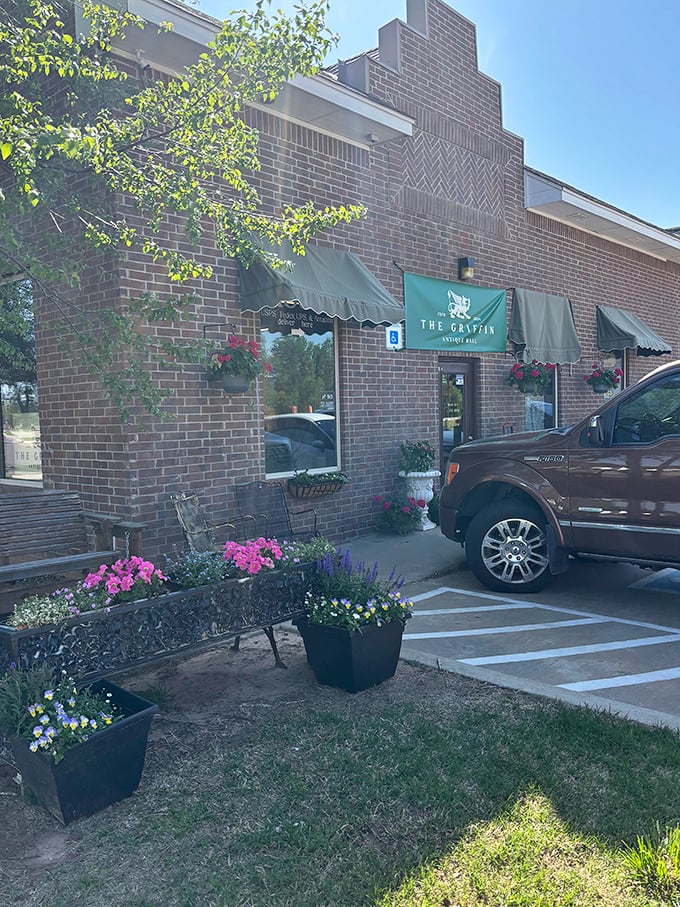 Like the entrance to Narnia, this doorway beckons with promises of forgotten worlds inside. The classical urns standing guard are your first clue.