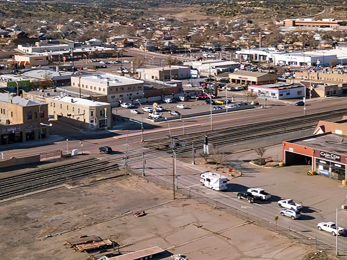 From this bird's-eye view, Gallup unfolds like a miniature model town, with its railroad heritage still visible in the tracks cutting through downtown.
