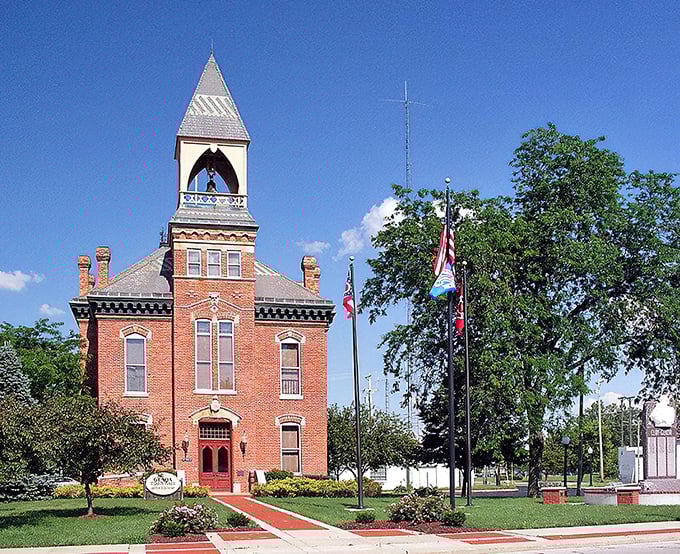 The historic Town Hall stands as Genoa's crown jewel, its distinctive clock tower and red brick fa&ccedil;ade telling stories of generations past while continuing to serve the community today.