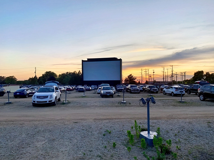 The magic hour at McHenry Outdoor Theater, when the sunset creates nature's perfect preshow and cars line up like eager moviegoers from a bygone era.