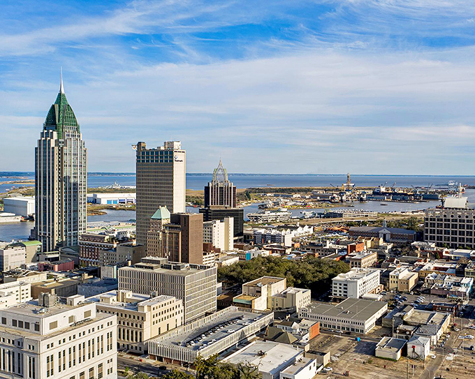 From this vantage point, Mobile's distinctive emerald-topped skyscraper stands sentinel over a city where history and modernity dance in perfect harmony.