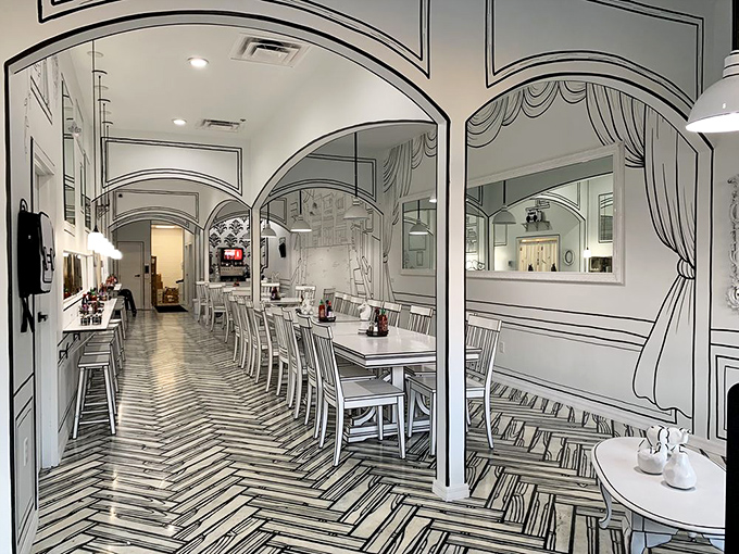 Step into a living sketchbook where reality blurs and appetites soar. The herringbone floor pattern draws you deeper into this monochromatic wonderland.