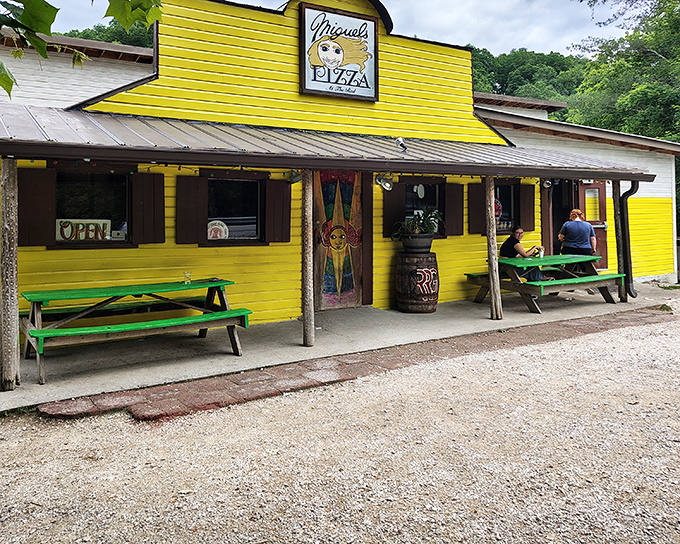 That sunshine-yellow exterior isn't just a building—it's a beacon of hope for hungry hikers and climbers seeking pizza salvation in the Kentucky wilderness.