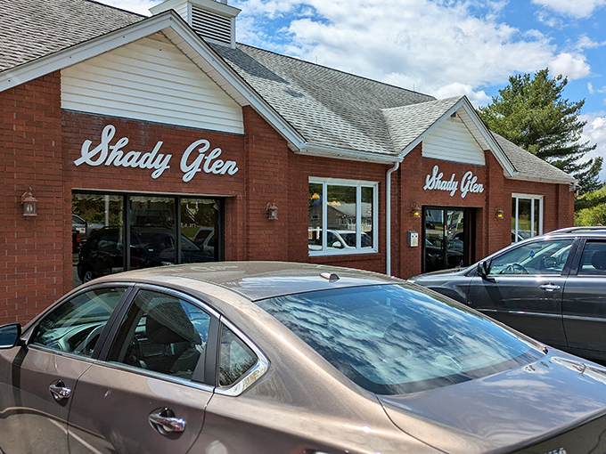 Sunshine bounces off Shady Glen's classic cursive signage, a beacon of hope for hungry travelers and locals alike.