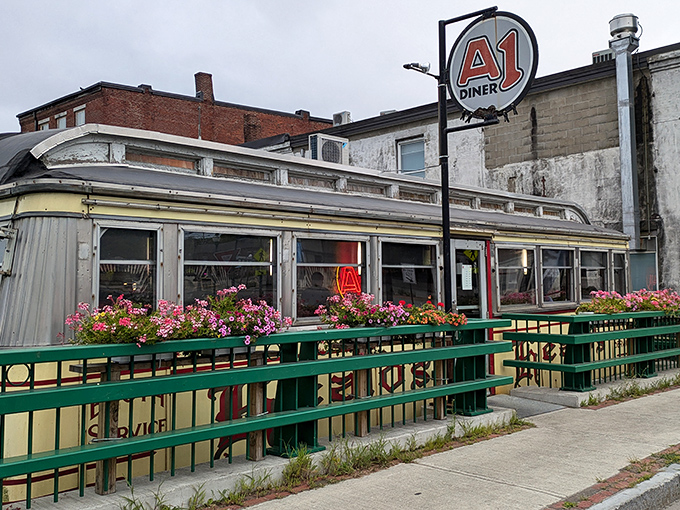 The classic Worcester Lunch Car silhouette of A1 Diner stands proudly in downtown Gardiner, complete with vibrant flower boxes that soften its industrial edges.