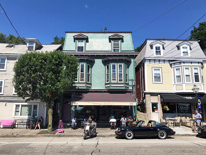 The mint-green Victorian facade of Dante's Kitchen stands proudly on East Greenwich's Main Street, promising breakfast adventures within those bay windows.