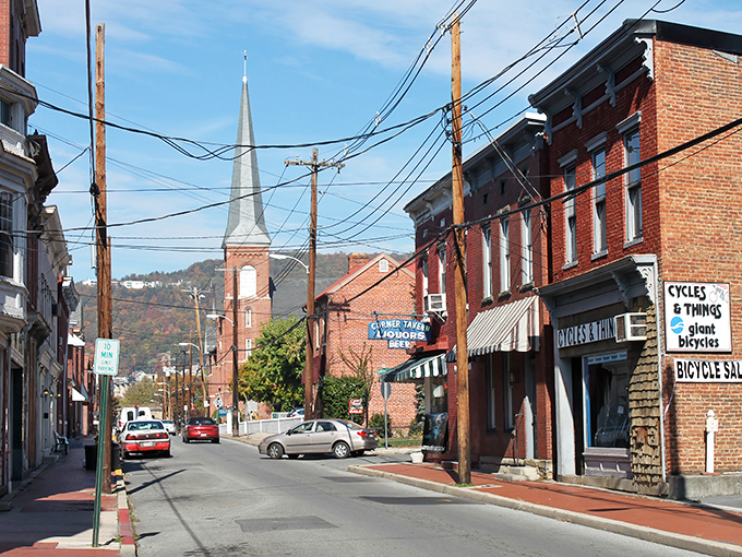 Historic church spires punctuate Cumberland's skyline while autumn mountains frame the scene, creating a postcard-worthy setting where retirement dollars stretch further than your morning walk.