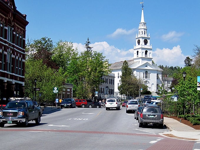 Main Street Middlebury looks like it was designed by Norman Rockwell himself, complete with that iconic white church spire reaching for Vermont's impossibly blue sky.