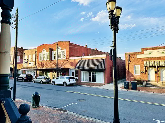 Historic brick storefronts line Goldsboro's downtown streets, where vintage lampposts stand sentinel over a scene that feels both timeless and refreshingly alive.