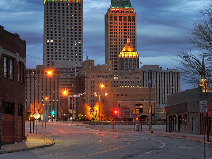 Twilight transforms Tulsa's skyline into a glowing testament to the city's architectural heritage, with the iconic Mid-Continent Tower standing sentinel.