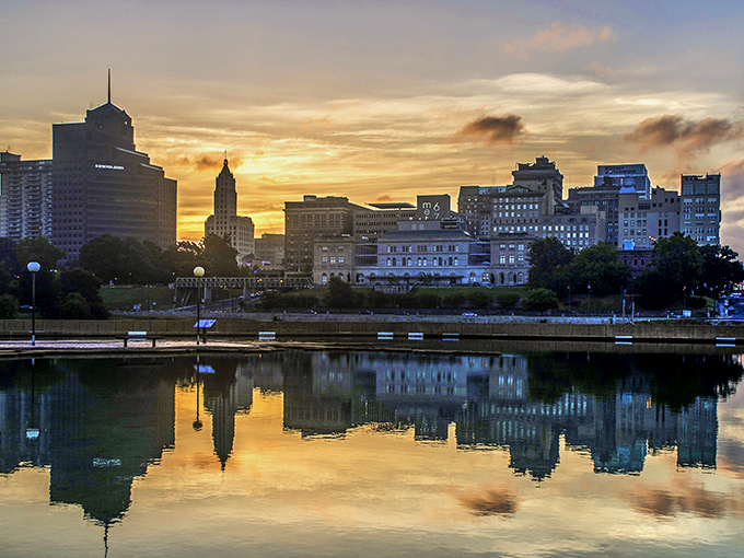 Memphis skyline at sunset creates a perfect mirror image on the Mississippi River, painting the city in gold that would make even Elvis jealous.