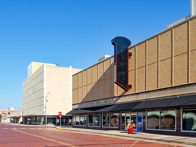 Historic brick buildings line downtown Lubbock's quiet streets under a brilliant blue Texas sky.