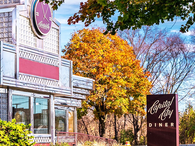 Fall's golden embrace frames Capital City Diner perfectly, its vintage sign and chrome exterior gleaming like a time capsule you can actually eat in.