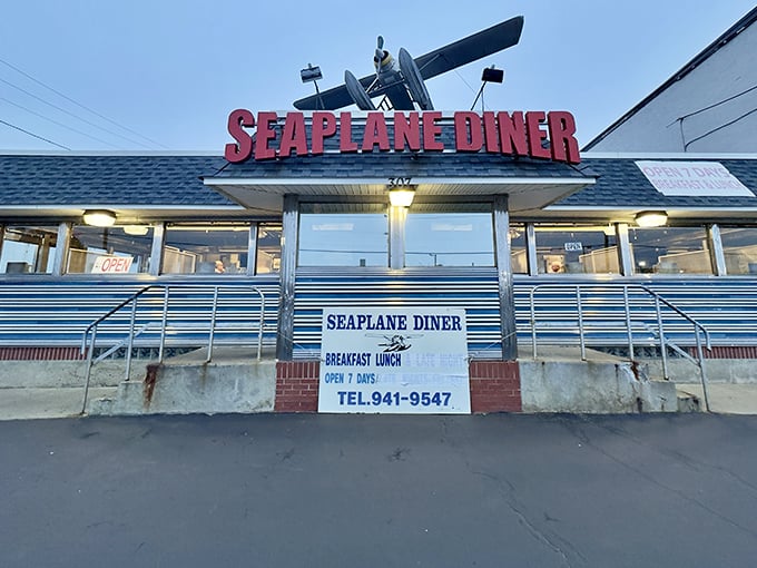 The iconic Seaplane Diner sign welcomes hungry travelers with its vintage airplane perched above&mdash;a beacon of breakfast hope on Providence's Allens Avenue.