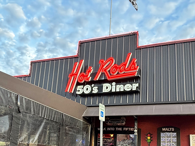That neon sign beckons like a lighthouse for the hungry soul. "Hot Rods" isn't just a name&mdash;it's a promise of the time-traveling feast that awaits inside.
