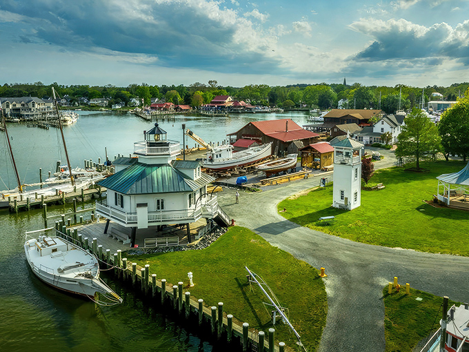 An aerial view of the Chesapeake Bay Maritime Museum showcases Saint Michaels' maritime heritage with its iconic lighthouse and historic vessels.