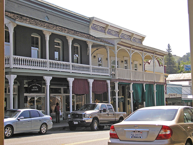 Main Street's Victorian balconies and colorful awnings aren't just for show&mdash;they're time machines disguised as architecture. History with a functional flair!