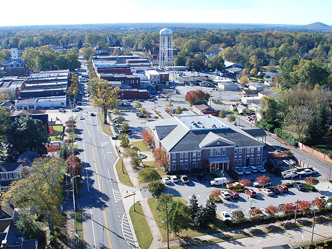 The iconic water tower stands sentinel over downtown Monroe, a beacon guiding treasure hunters to this antiquing paradise.