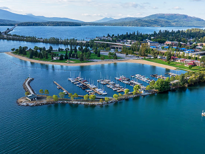 City Beach Park in Sandpoint offers a perfect circular oasis where emerald waters meet manicured greenery. Mother Nature showing off her landscaping skills at their finest.