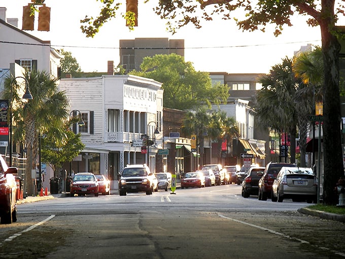 Golden hour illuminates Beaufort's historic district, where palm trees frame well-preserved buildings dating back to the 18th century.