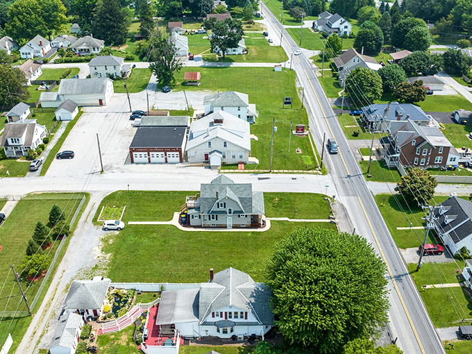 West Chester's residential charm unfolds in this aerial view, where well-maintained homes with generous lawns create the quintessential American neighborhood experience.