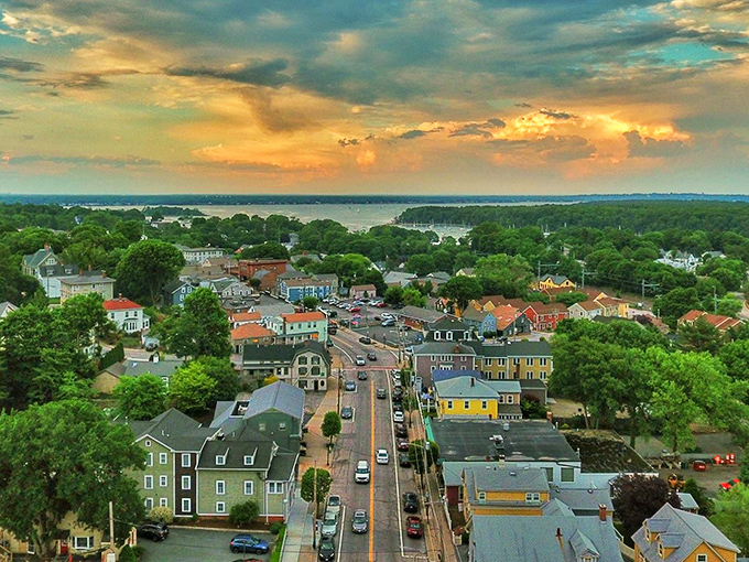 Sunset bathes East Greenwich in golden light, where historic homes and Main Street lead gracefully to the shimmering waters of Narragansett Bay.