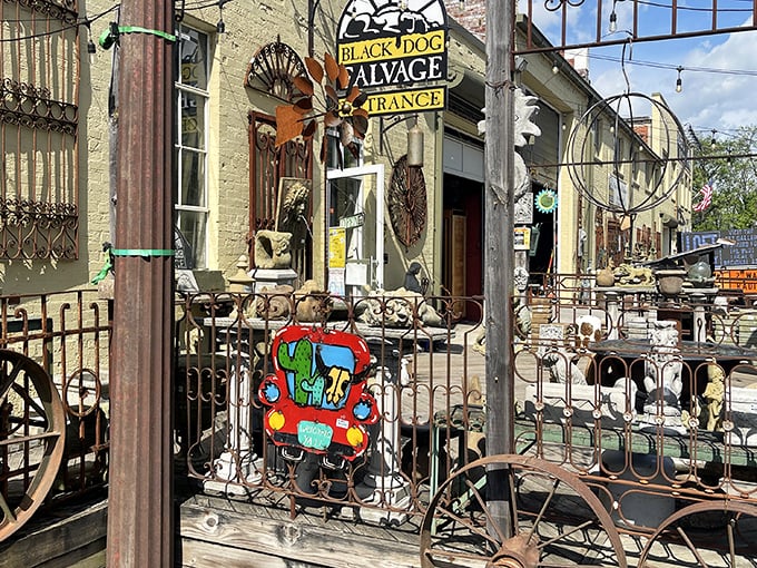 The whimsical entrance to Black Dog Salvage, where vintage treasures and architectural history await beyond the gate.