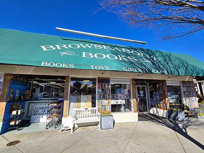 The iconic green awning of Browseabout Books stands out against the blue Rehoboth sky, beckoning bibliophiles like a literary lighthouse on the shore.