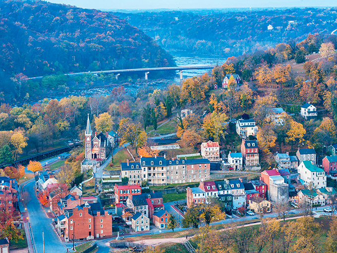 The town nestles between mountains like a historical jewel in nature's setting, the bridge spanning not just water but centuries.
