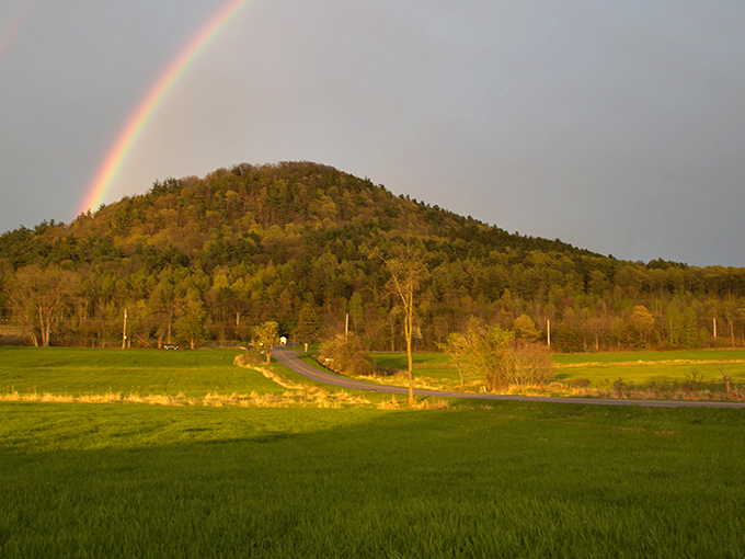 Nature's own endorsement: a rainbow crowns Mount Philo in autumn splendor, proving even the sky celebrates this Vermont treasure.