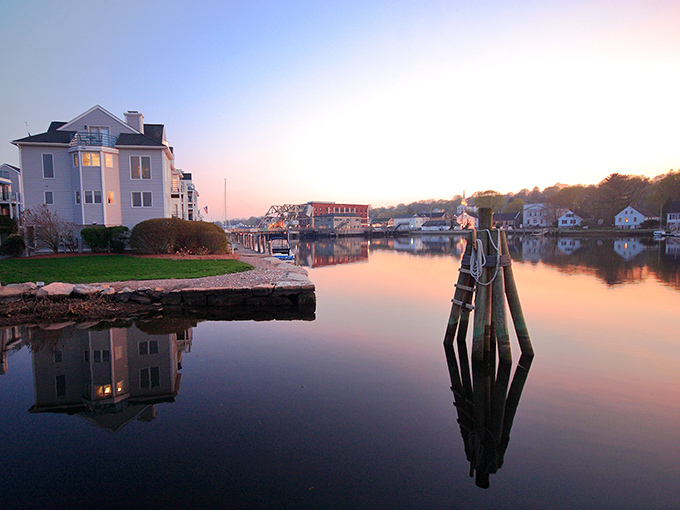 Sunset transforms Mystic River into a mirror of tranquility, where waterfront homes glow with golden light. Pure New England magic without the Cape Cod traffic.