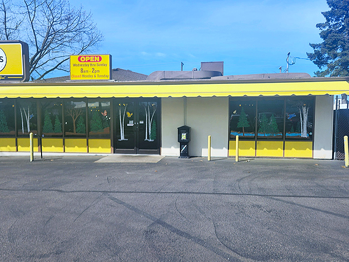 The bright yellow awning of GJ's Family Restaurant stands out like a culinary lighthouse, beckoning hungry travelers with promises of comfort food that satisfies the soul.