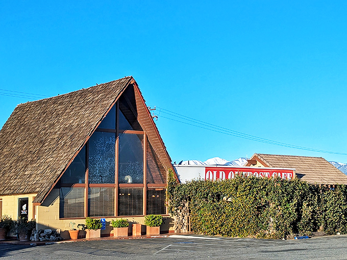 The iconic A-frame entrance of Outpost Cafe stands like a rustic beacon for hungry travelers, promising comfort food salvation in the High Desert.