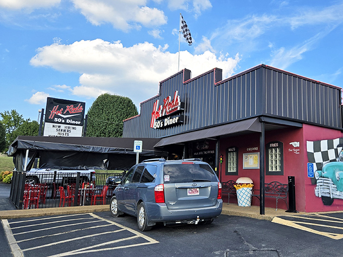 The neon sign beckons like a lighthouse for the hungry&mdash;Hot Rods 50's Diner stands ready to transport you back in time, checkered flag and all.