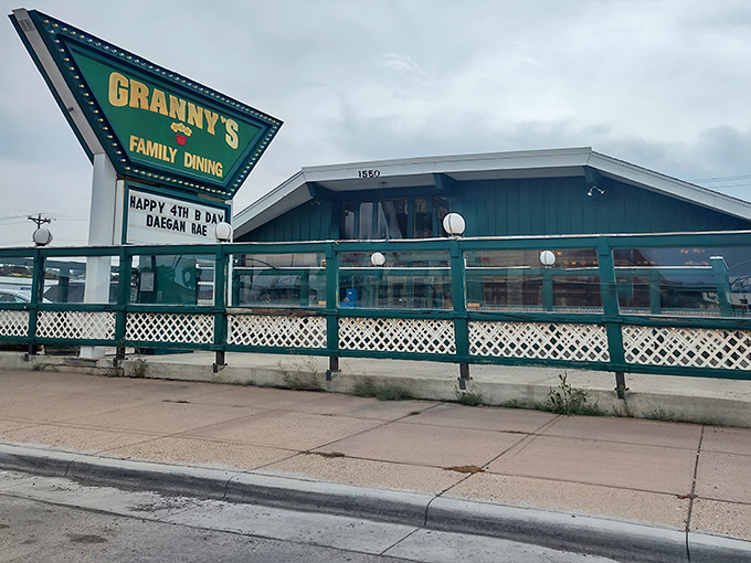 The iconic green triangular sign welcomes hungry travelers like a beacon of breakfast hope in the Wyoming landscape.