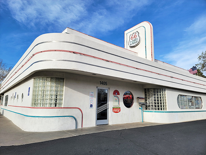 Architectural curves that would make a '57 Chevy jealous define this corner view of the 66 Diner, where every angle is Instagram-worthy before Instagram was even a thing.
