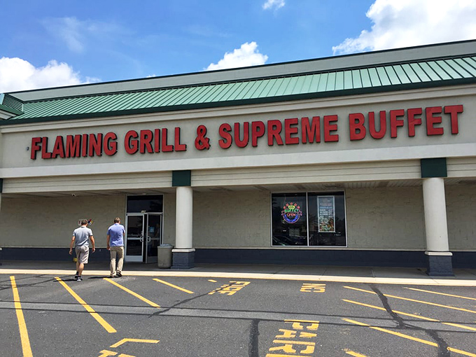 The red letters beckon like a siren song to hungry travelers. This unassuming strip mall exterior hides a world of culinary treasures within.