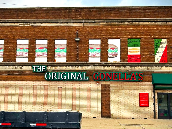 The brick facade tells you everything: this isn't about fancy frills, it's about sandwich fundamentals executed to perfection. Those colorful window murals are basically Detroit's version of the Sistine Chapel.