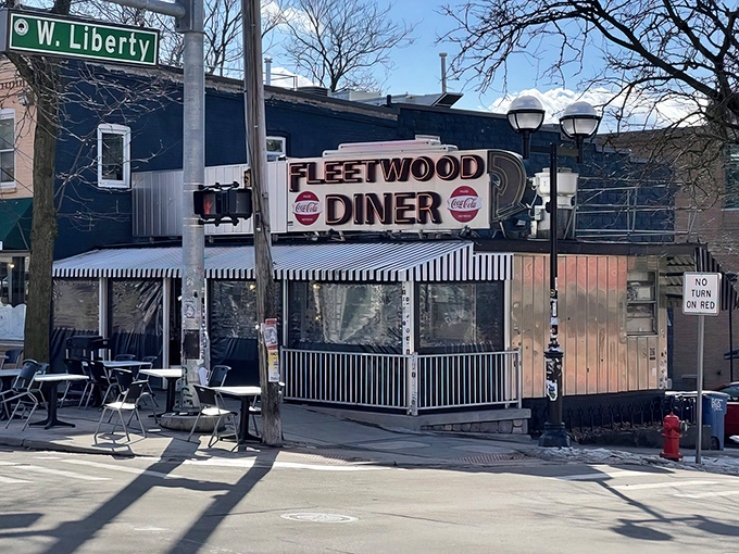 The iconic silver exterior of Fleetwood Diner stands like a time capsule on Liberty Street, its vintage sign promising comfort food salvation 24/7.