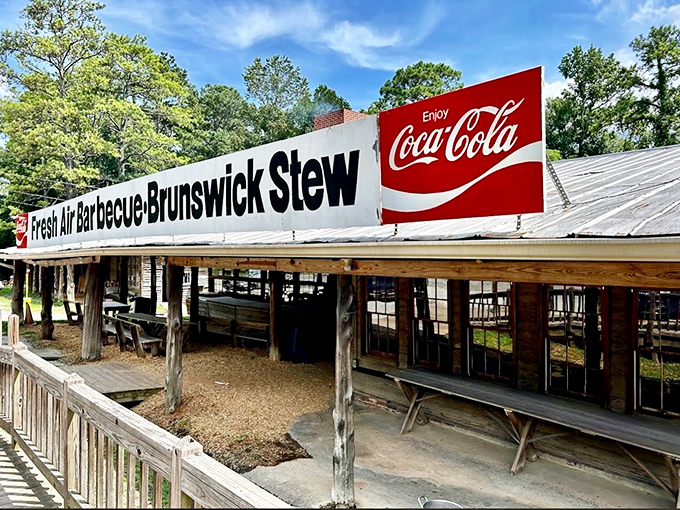 The barbecue promised land reveals itself with a humble facade, brick chimney standing sentinel over decades of smoke-infused tradition.