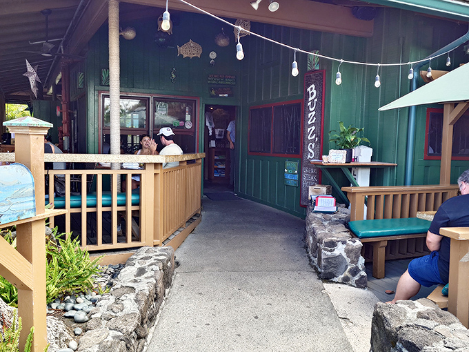 Buzz's iconic exterior welcomes you like an old friend, offering natural shade for this beloved Kailua institution.