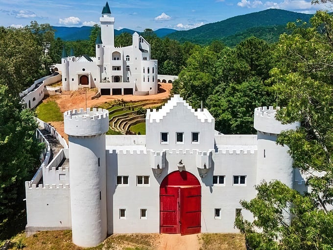 White towers rising from Georgia mountains like a fairy tale that forgot to check its GPS coordinates first.