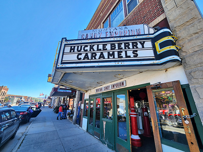 The iconic marquee announces "Huckleberry Caramels" like it's the summer blockbuster your taste buds have been waiting for.