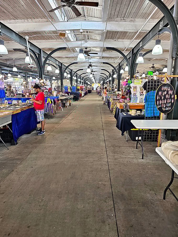 Shoppers wander through rows of stalls stacked with handmade goods, where every table holds a surprising mix of items waiting to be discovered.