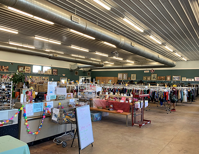 Industrial ceilings and exposed ductwork create the perfect backdrop for this organized chaos of secondhand delights.