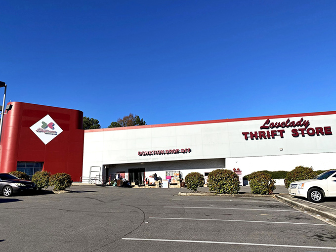 The red and white exterior of Lovelady Thrift Store stands proudly against the Alabama sky, like a beacon calling bargain hunters home.