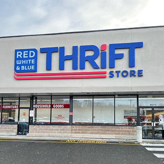 The patriotic blue sign beckons bargain hunters like a retail lighthouse. Welcome to Waterbury's temple of thrift, where treasures await discovery.
