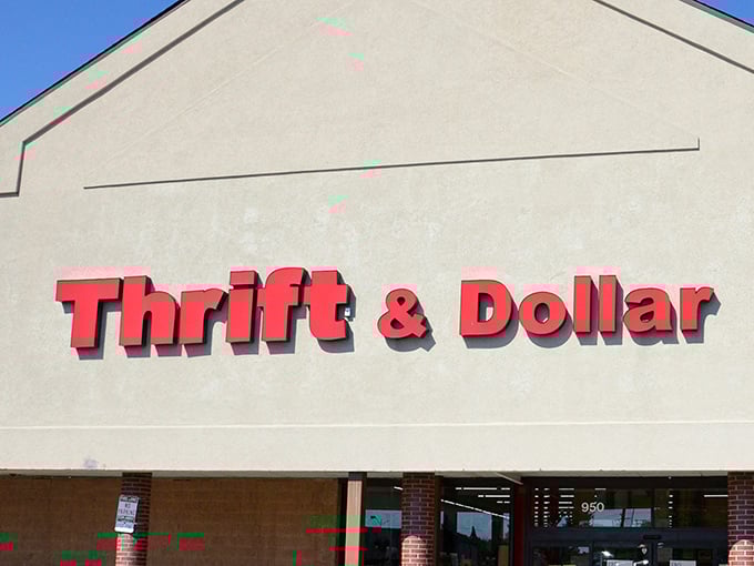 The bright red signage of Thrift & Dollar Inc stands out like a beacon for bargain hunters, promising treasures within its unassuming exterior.