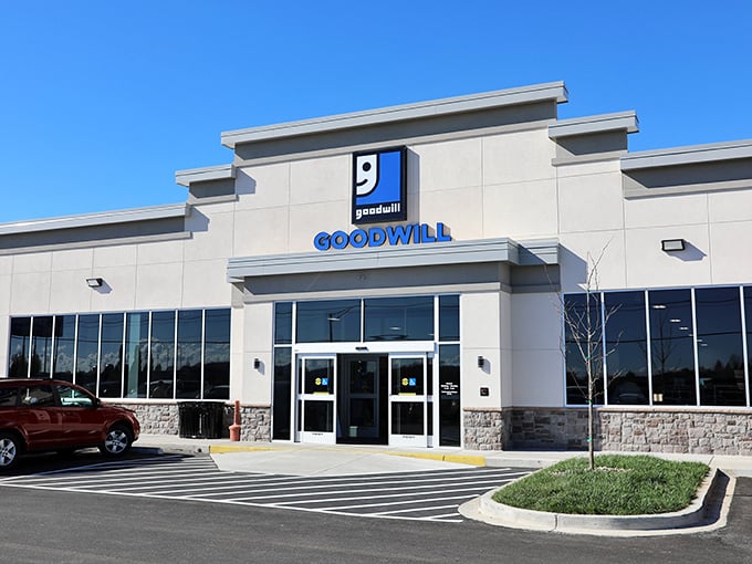 The modern facade of Somerset's Goodwill Super Store stands ready to welcome bargain hunters with its clean lines and bright blue signage.