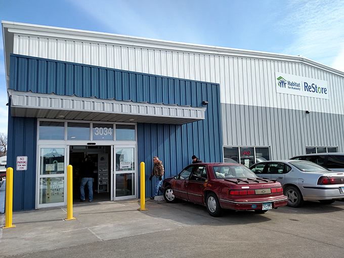 The blue and white exterior of Rochester's ReStore stands like a humble treasure chest waiting to be unlocked by bargain hunters and DIY dreamers alike.